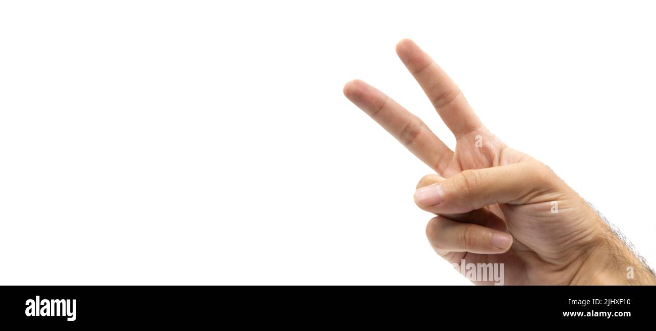 Adult hand making peace sign isolated on white background. Making two ...