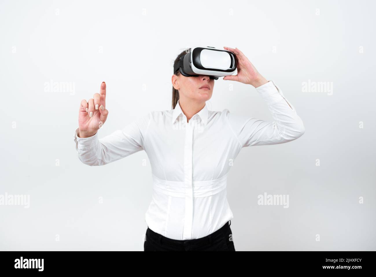 Woman Wearing Vr Glasses And Pointing On Important Messages With One ...