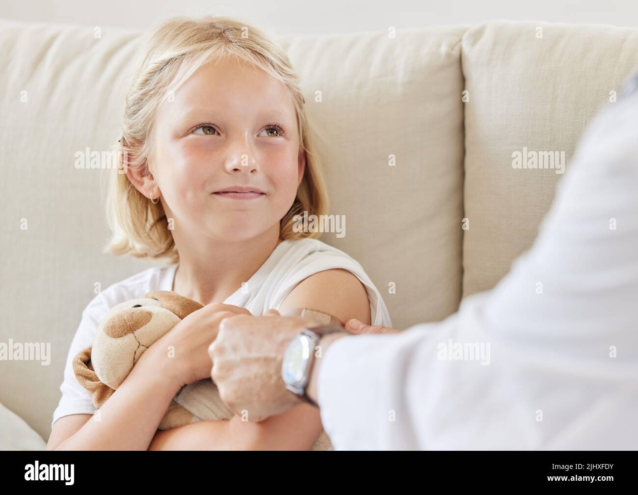 Little girl makes a big decision. an unrecognizable male doctor ...