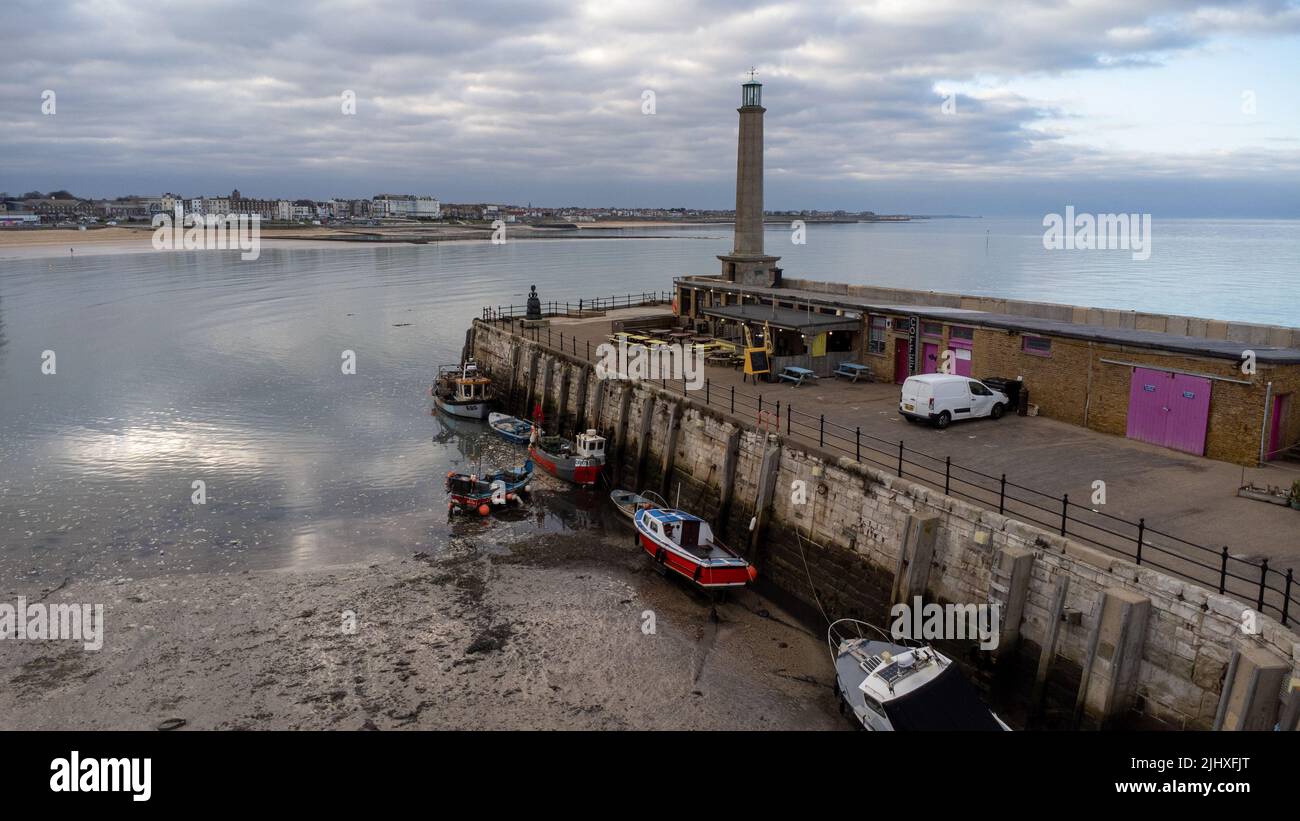 Margate harbour blue sea lighthouse cloudy day calm water Stock Photo ...