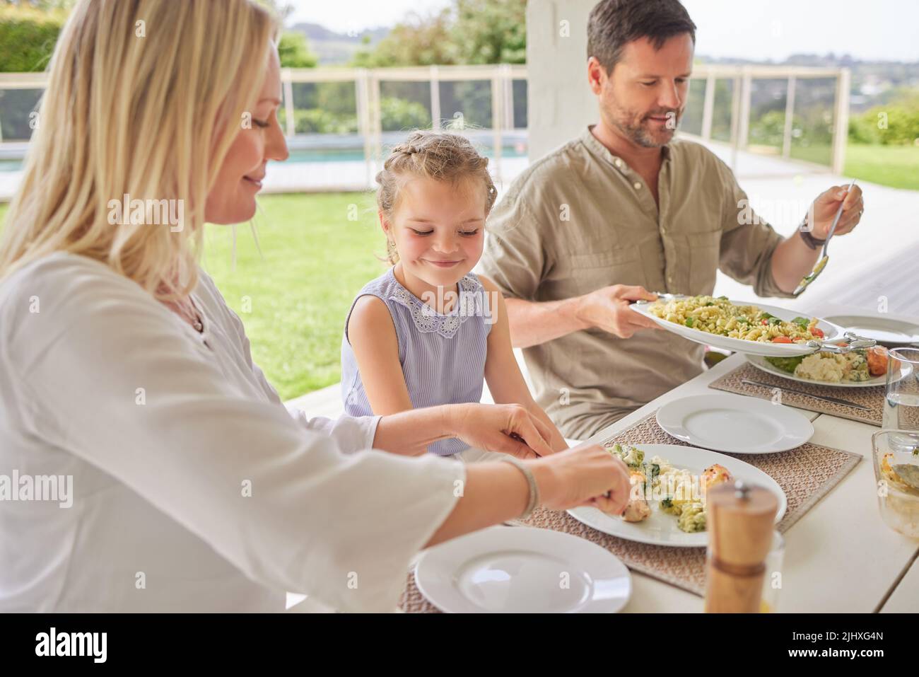Spending time together is what matters. a family enjoying sunday lunch ...