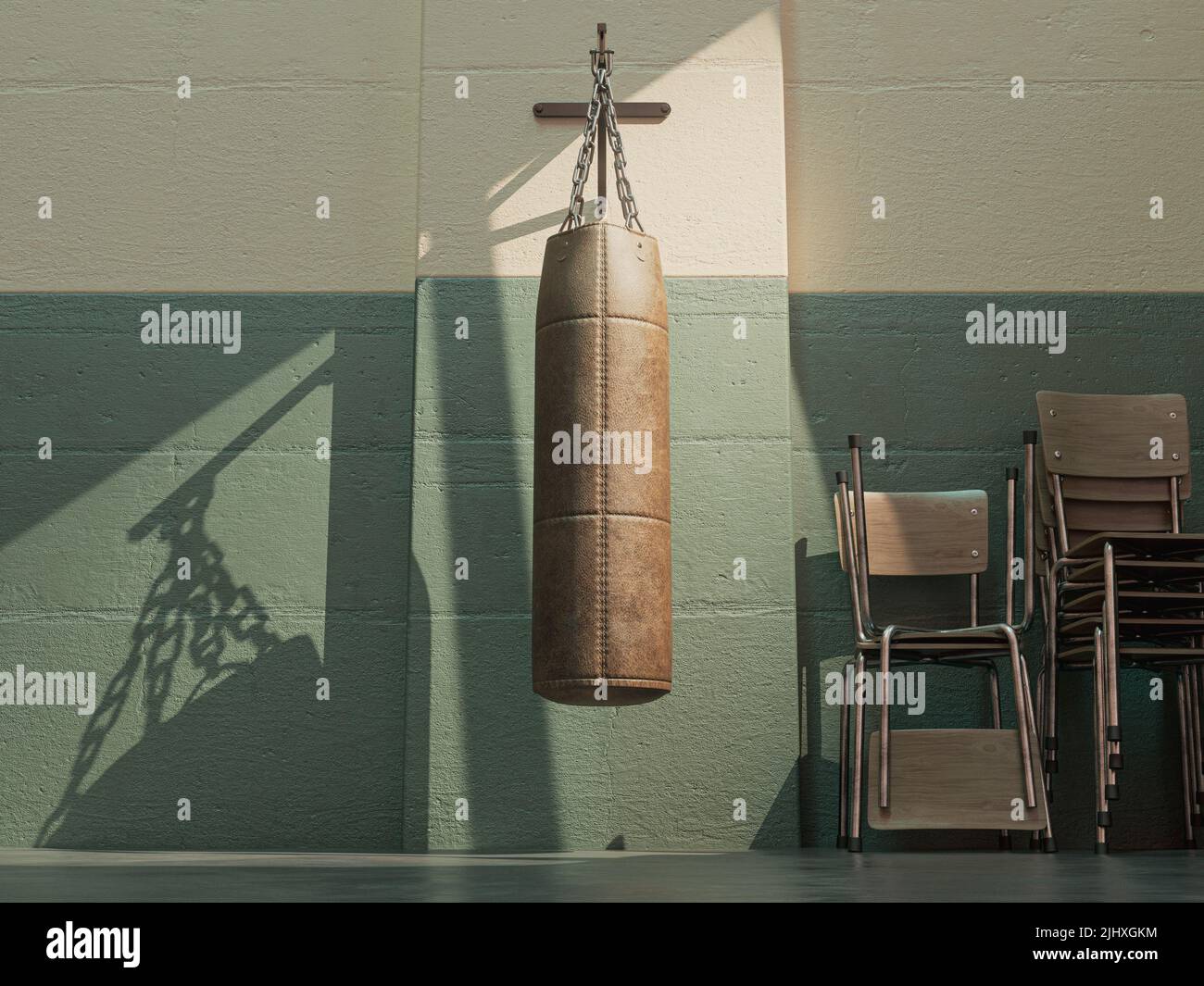 A old vintage leather punching bag mounted on a green wall in a room ...