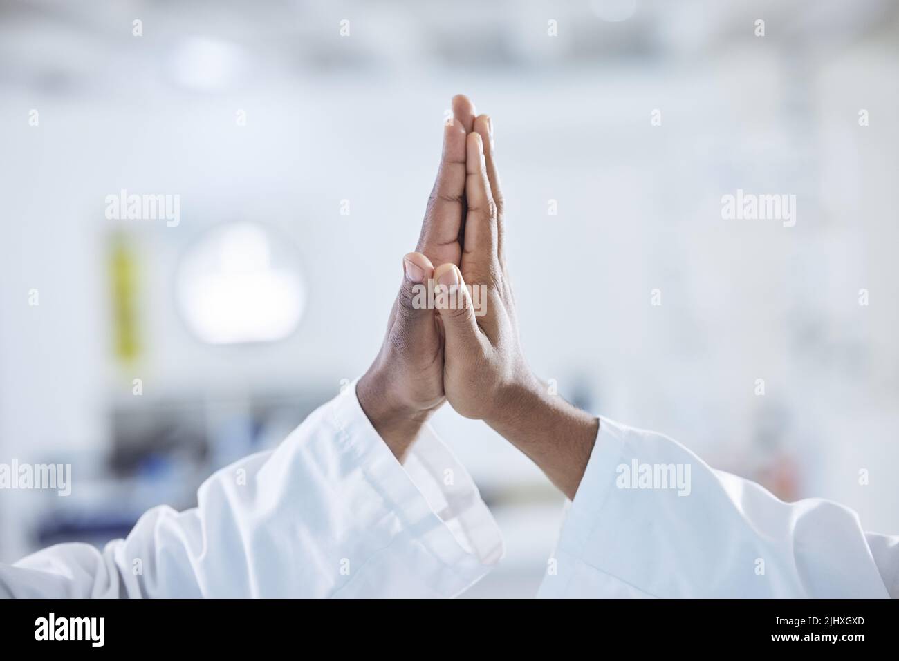 Closeup of two unknown african american medical scientists using hand ...