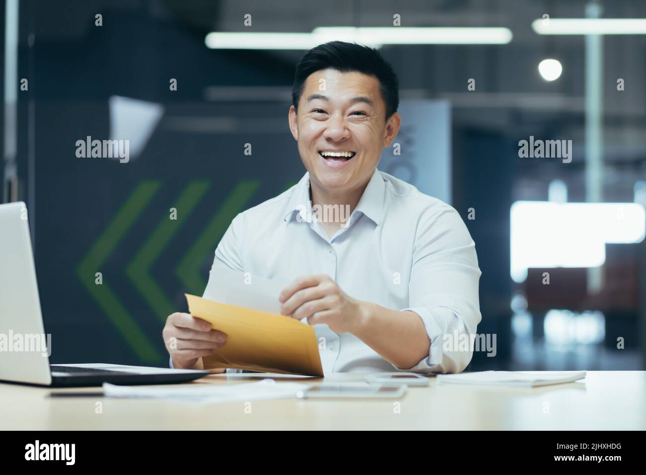 Portrait of successful Asian investor, man puts money money cash in ...