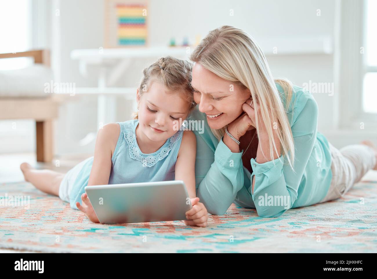 Lets put your intelligence to the test. an adorable little girl using a ...