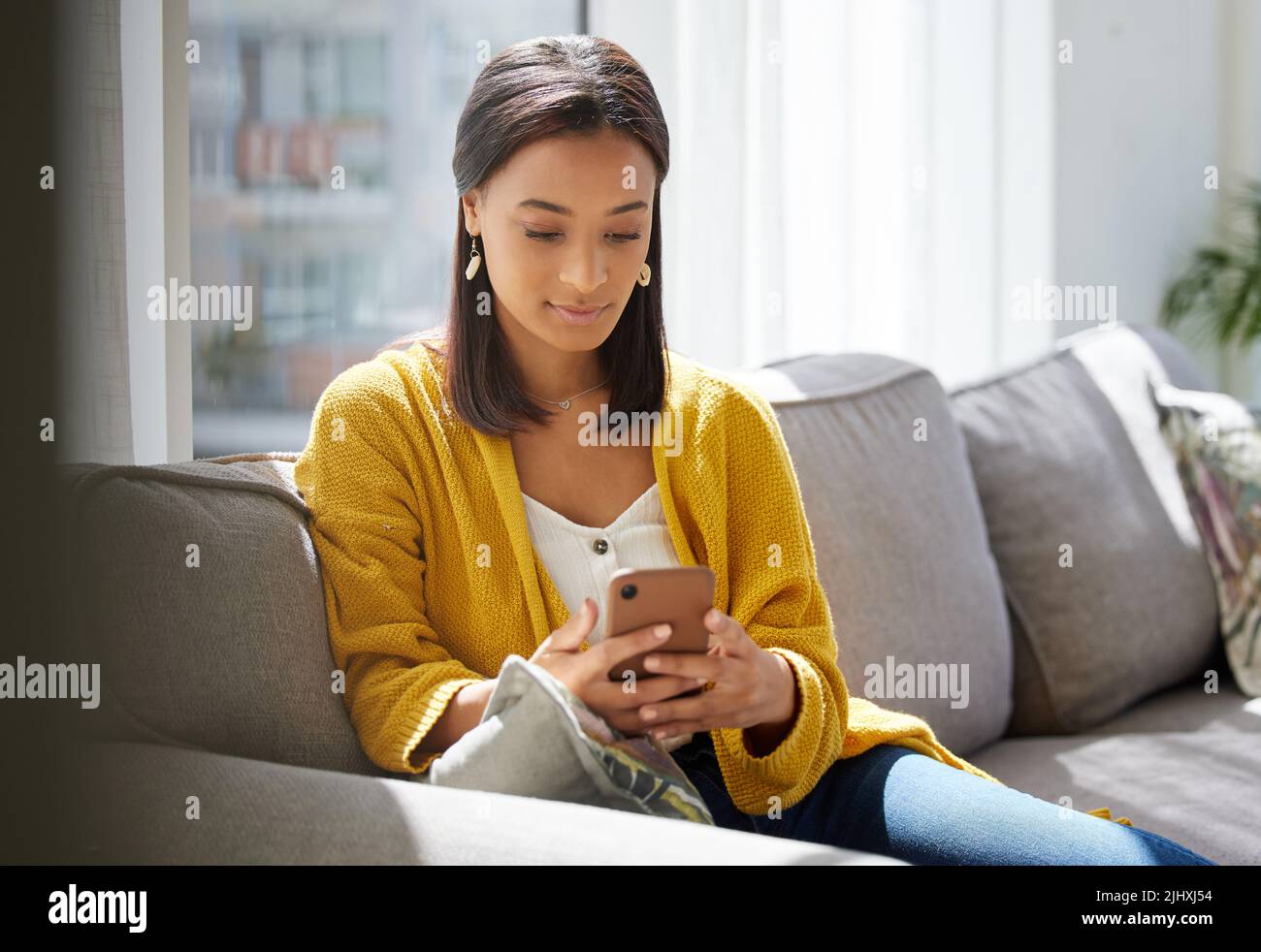 Woman uses smart phone hi-res stock photography and images - Alamy