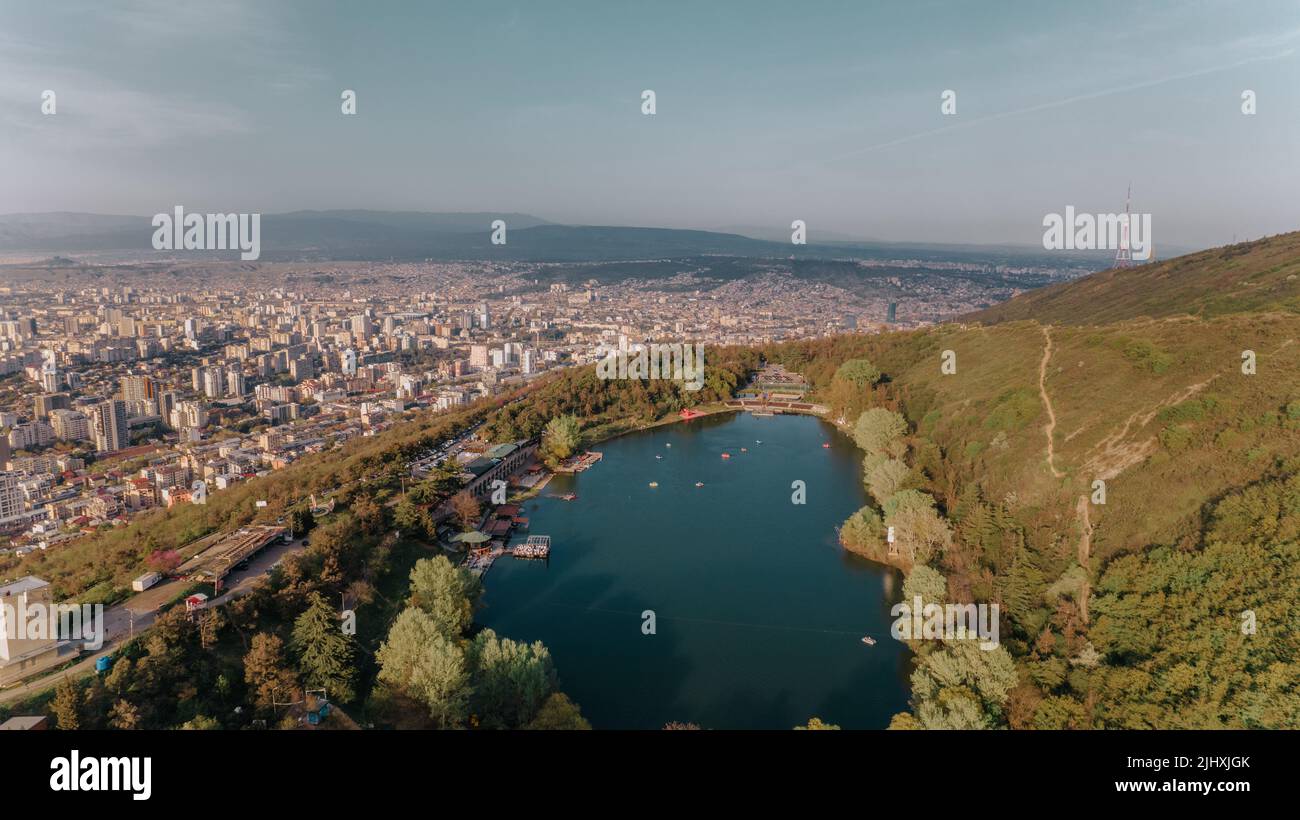 An aerial view of Turtle Lake with the Tbilisi cityscape in the ...