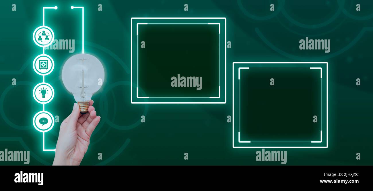 Businesswoman Hand Holding Light Bulb In Digitally Generated Frame With ...