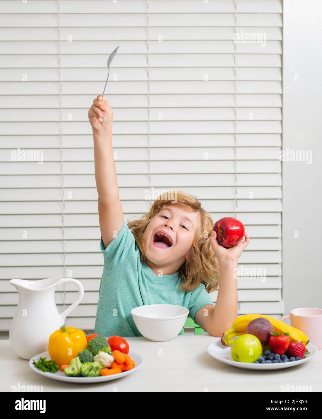 Portrait of preteen excited amazed child eat fresh healthy food in ...