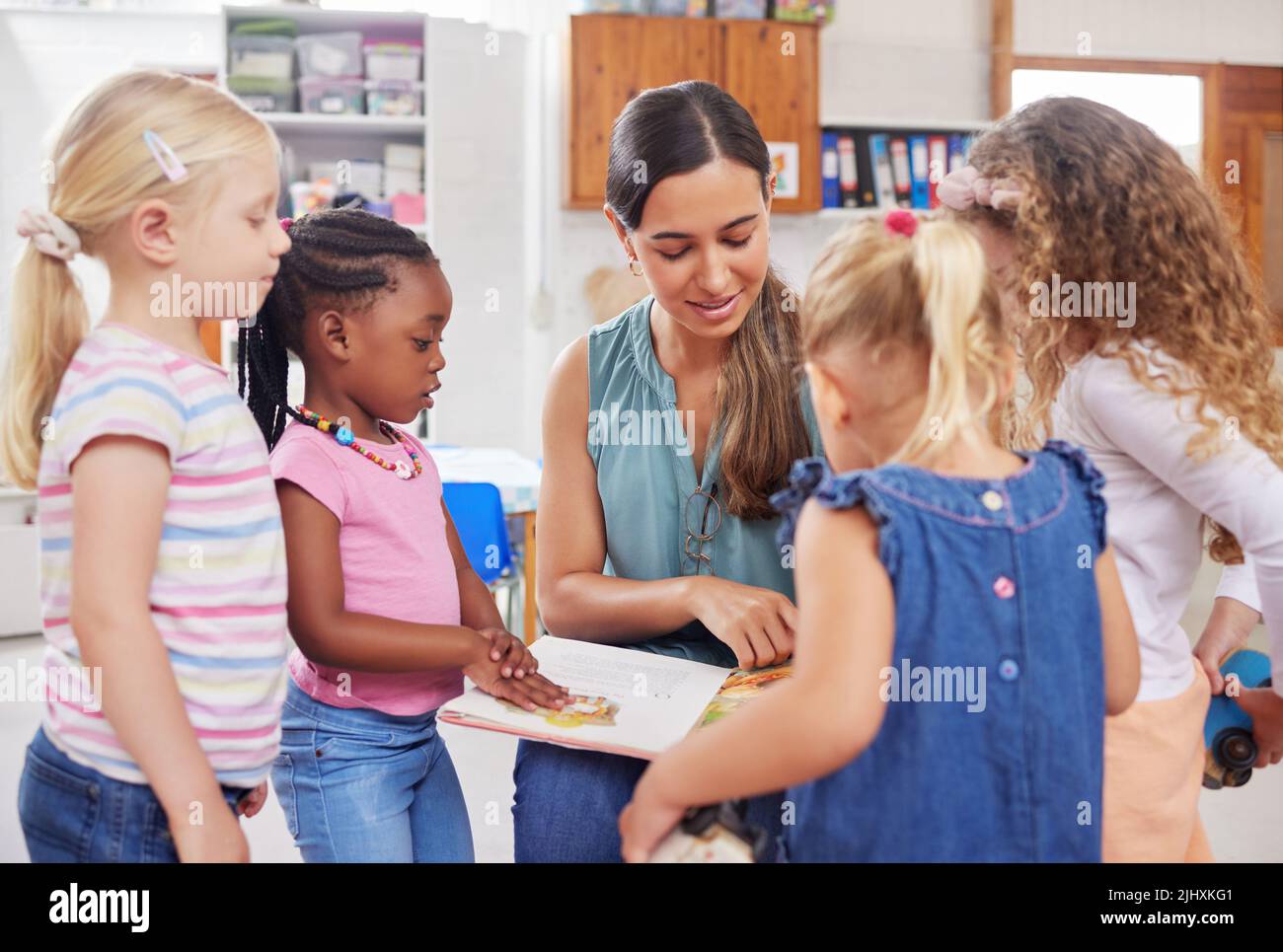 A preschool is the beginning of the learning experience. a young woman ...