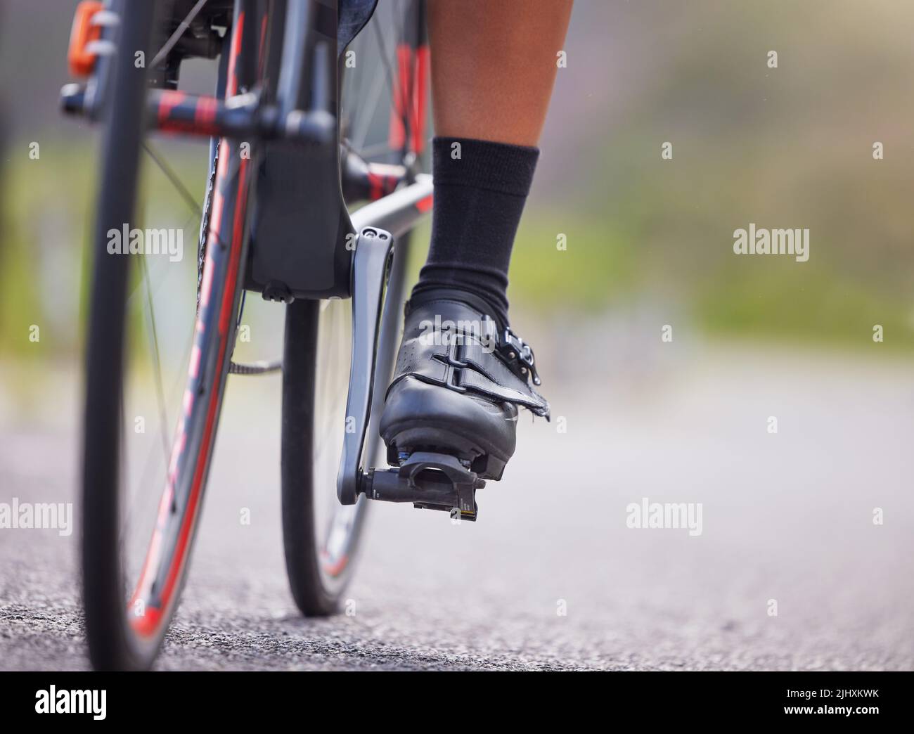 Closeup of the feet of one young woman exercising outside in the forest ...