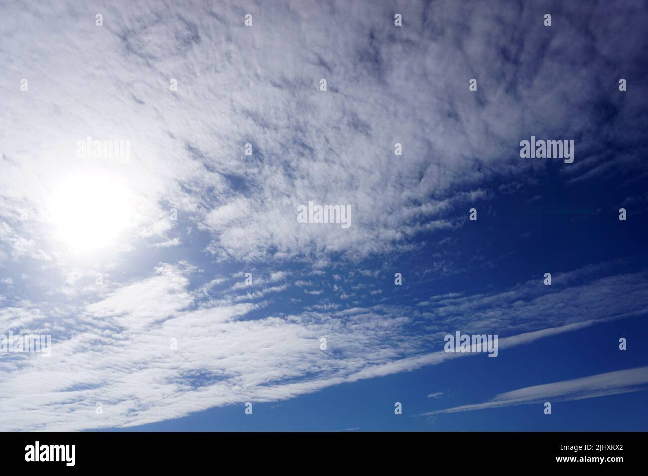 Blue sky with clouds - horizontal photograph Stock Photo - Alamy