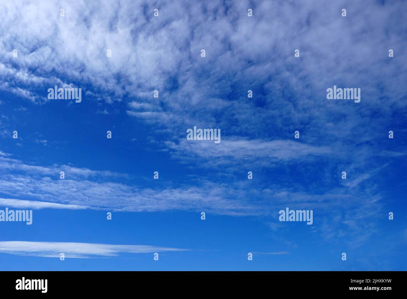 Blue sky with clouds - horizontal photograph Stock Photo - Alamy