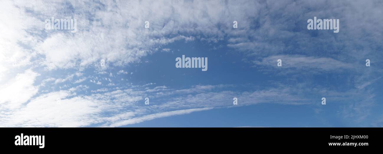 Blue sky with clouds - horizontal photograph Stock Photo - Alamy