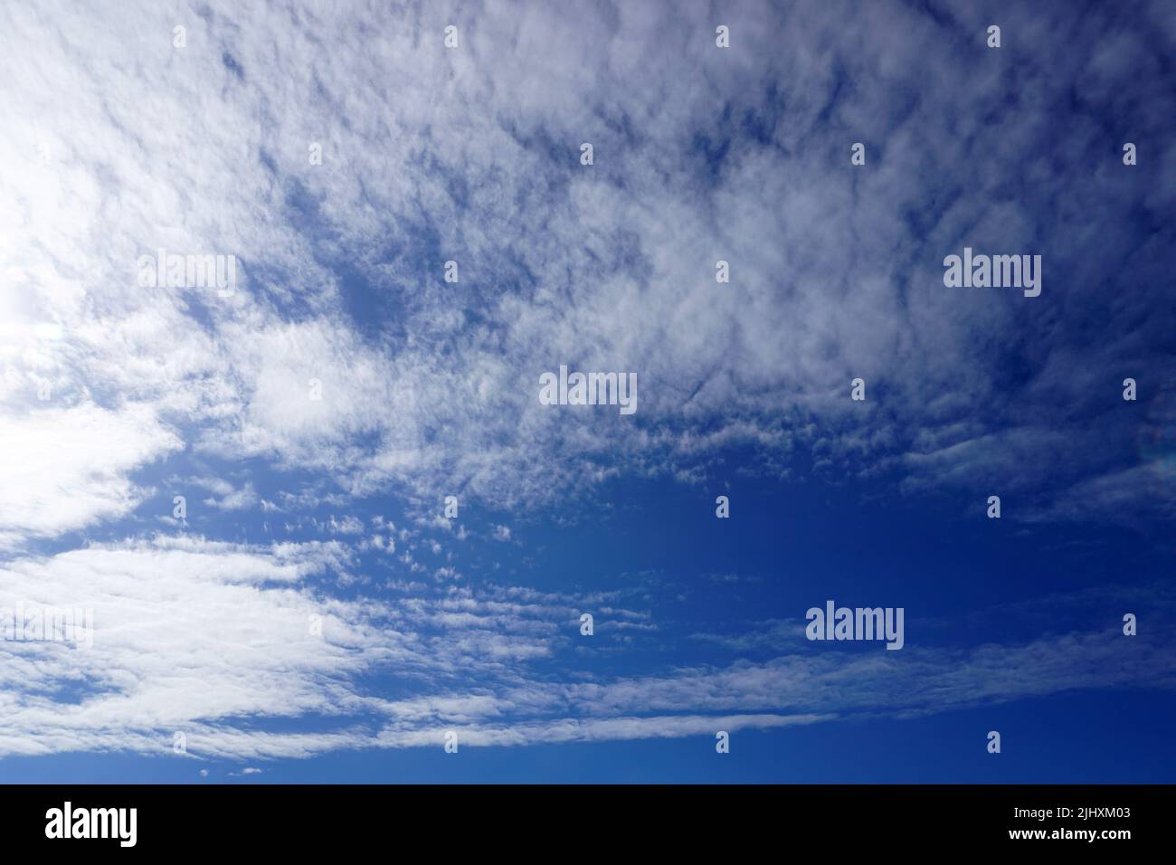 Blue sky with clouds - horizontal photograph Stock Photo - Alamy