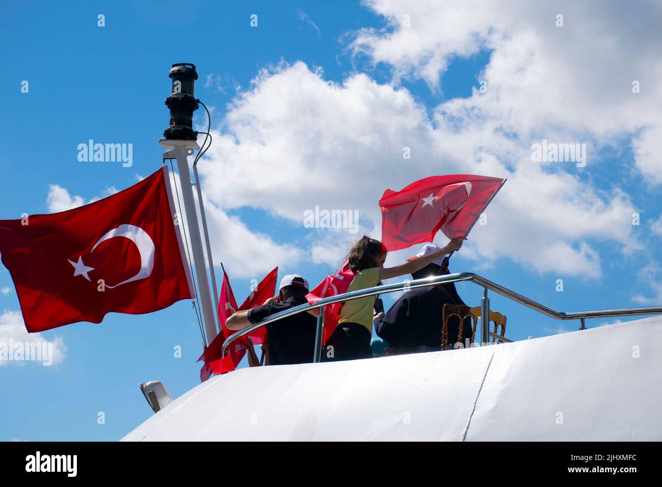 Turkey - July 2022: Little girl waving Turkish flag on a ship. Young ...