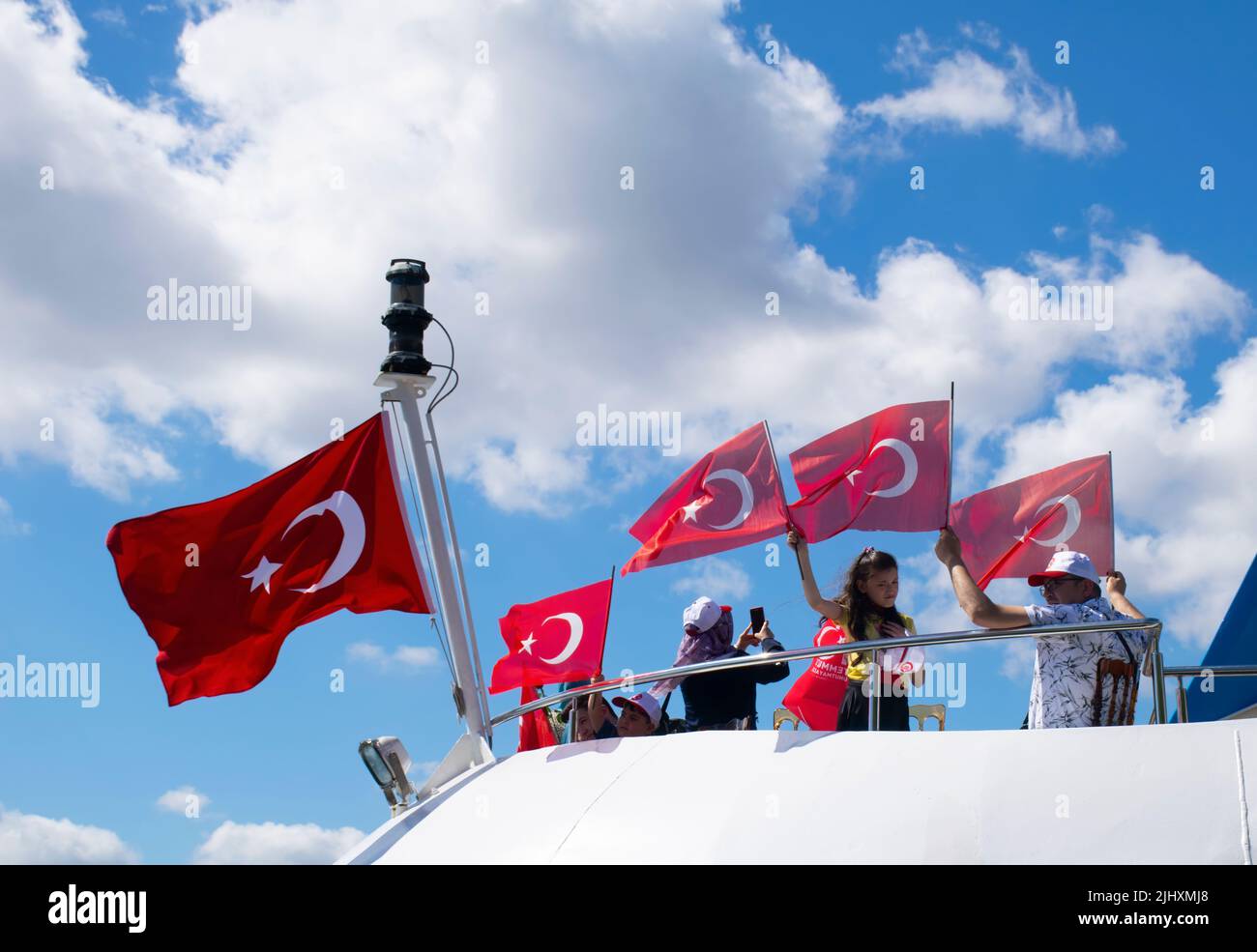 Turkey - July 2022: Little girl waving Turkish flag on a ship. Young ...