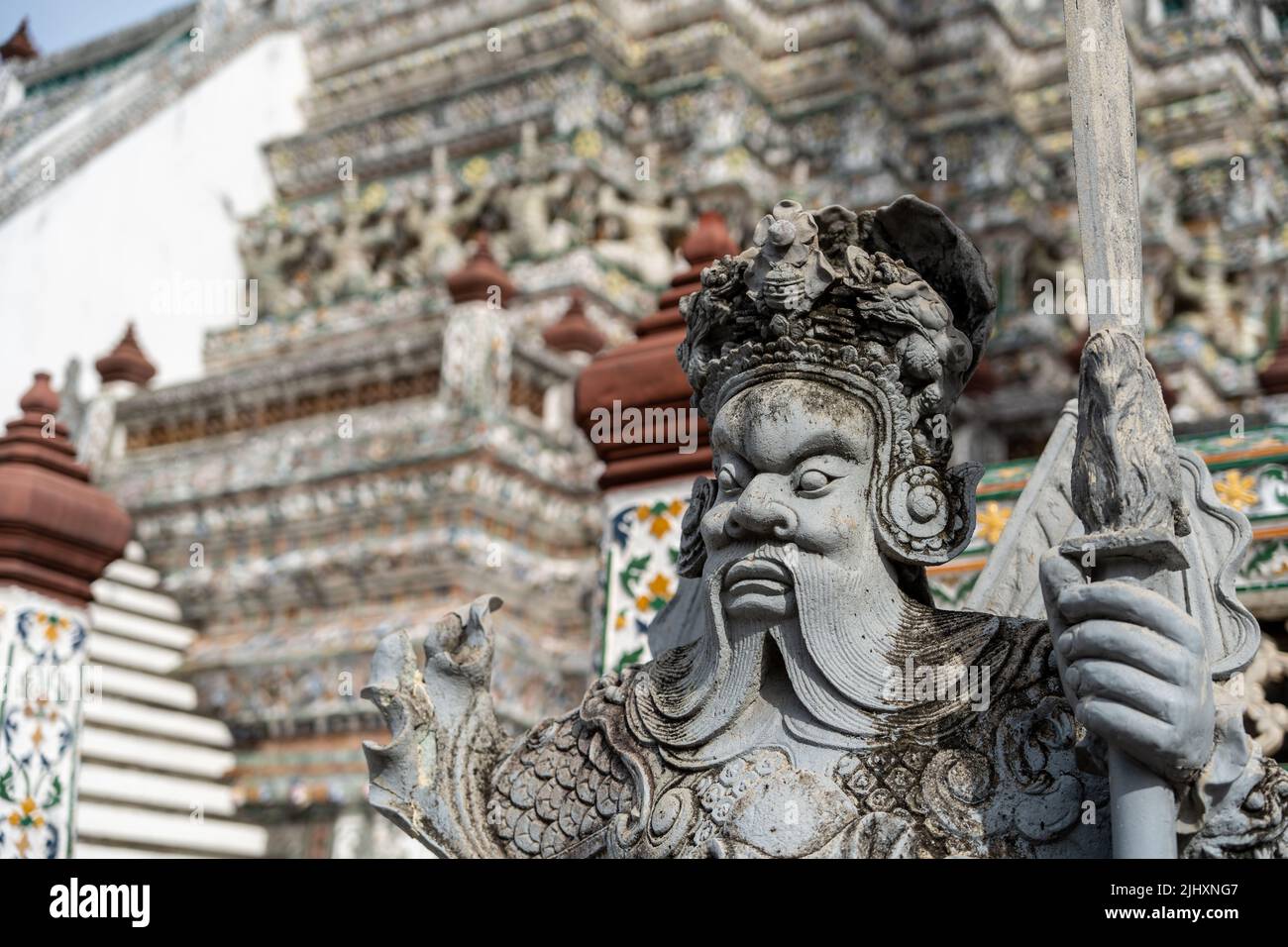An old warrior stone statue in a wat in a blurred background Stock ...