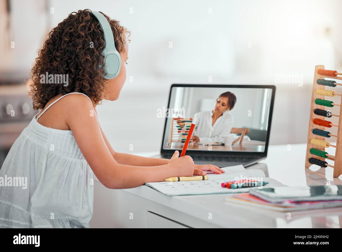 Learning through observation. a little girl in a virtual class from ...