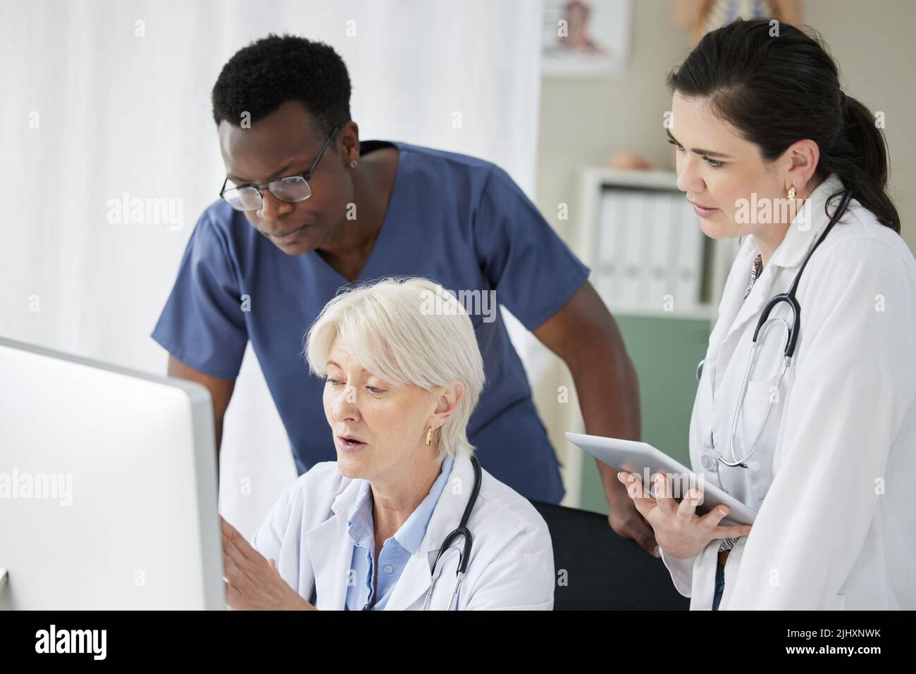 The learning never stops. a senior doctor giving her staff members ...