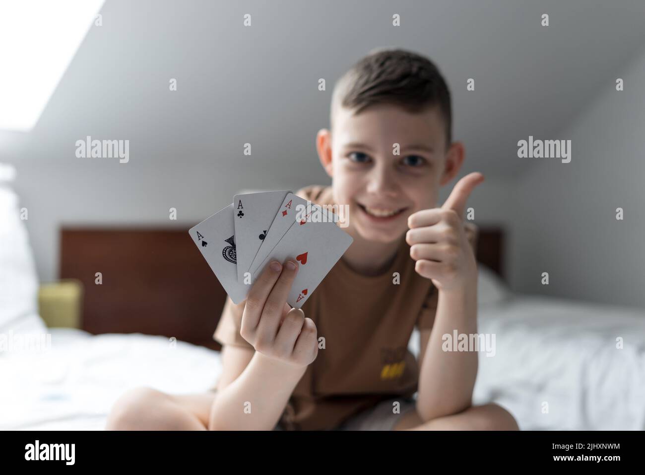 Happy teen boy playing game hi-res stock photography and images - Alamy