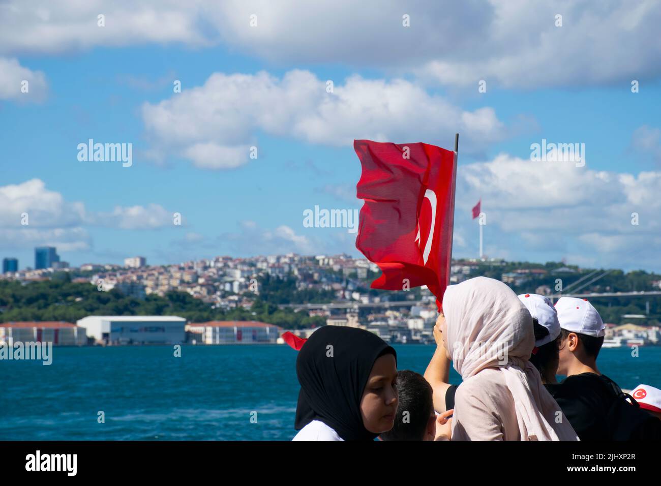 Istanbul, Turkey - July 2022: Young man holding the Turkish flag and ...