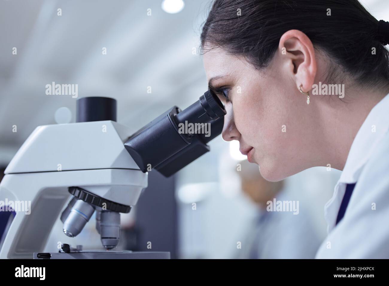 The most important discovery of her time. a young female lab tech using ...