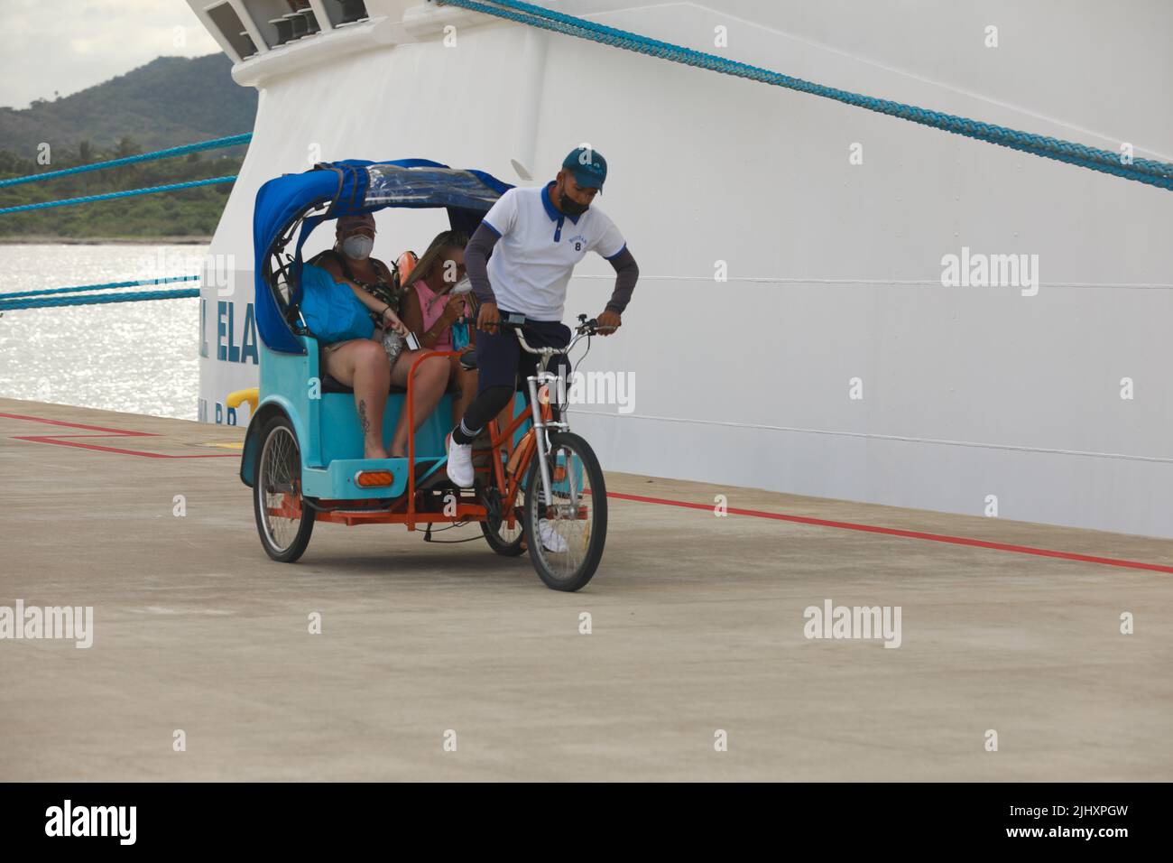 Bicycle rickshaw transferring guests from cruise ship terminal complex ...