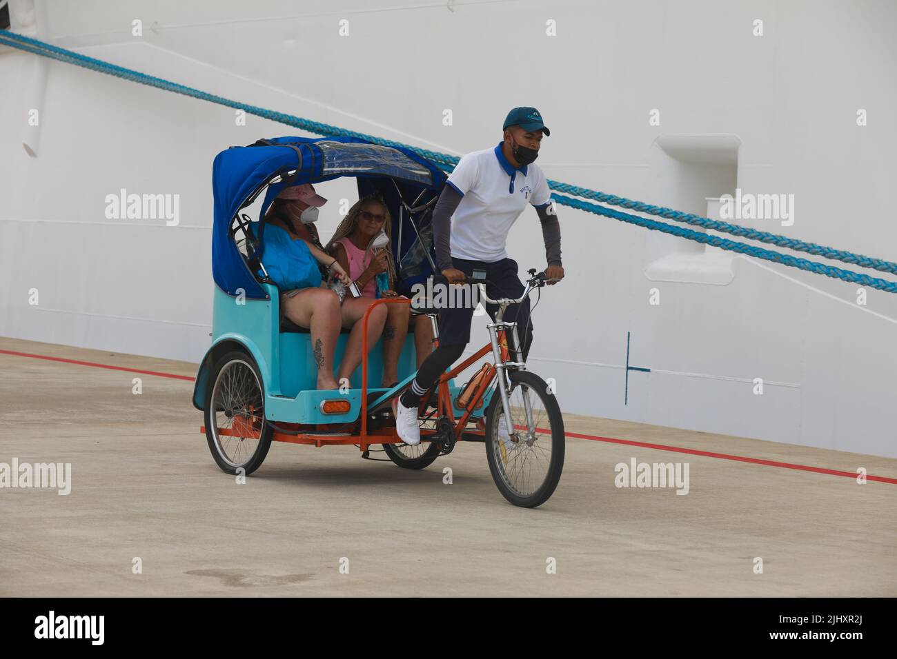 Bicycle rickshaw transferring guests from cruise ship terminal complex ...
