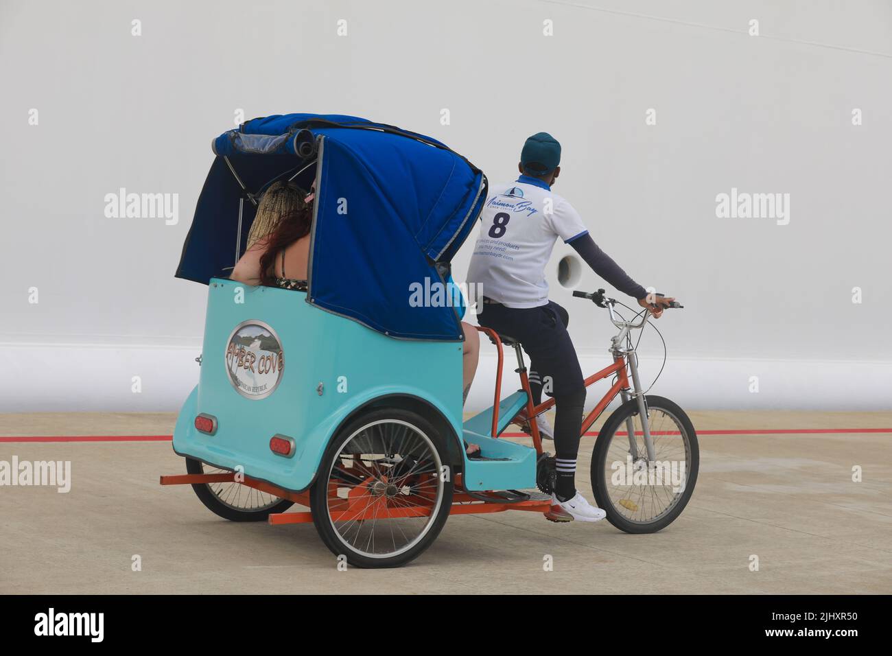 Bicycle rickshaw transferring guests from cruise ship terminal complex ...