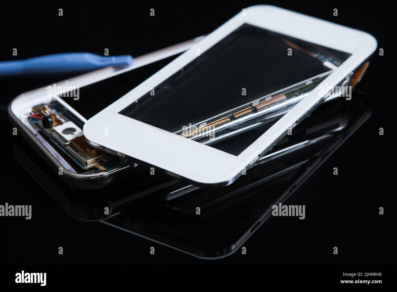 smartphone repairs workshop black background Stock Photo - Alamy