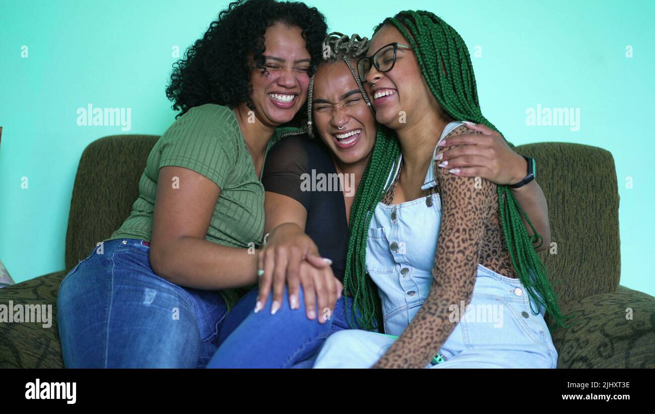 Joyful three black latina women laughing and smiling. Girlfriends ...