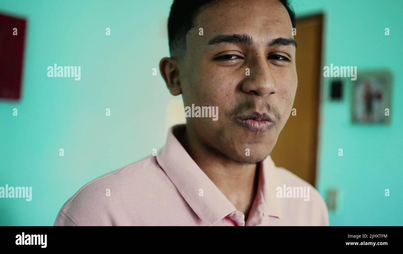 One young hispanic man holding laugh person trying not to laugh Stock ...