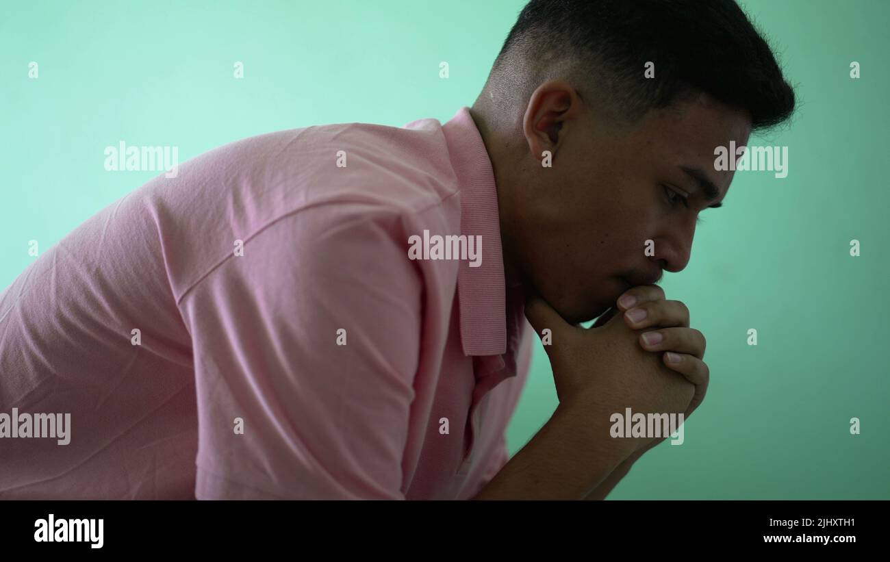 Regretful young man shaking head remembering bad memories. Person ...