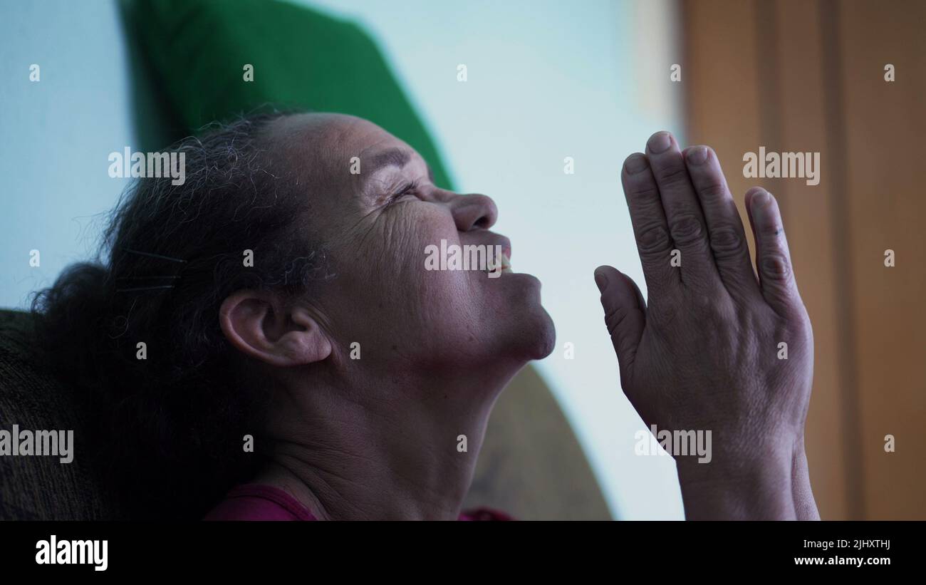Serene older woman praying god hi-res stock photography and images - Alamy