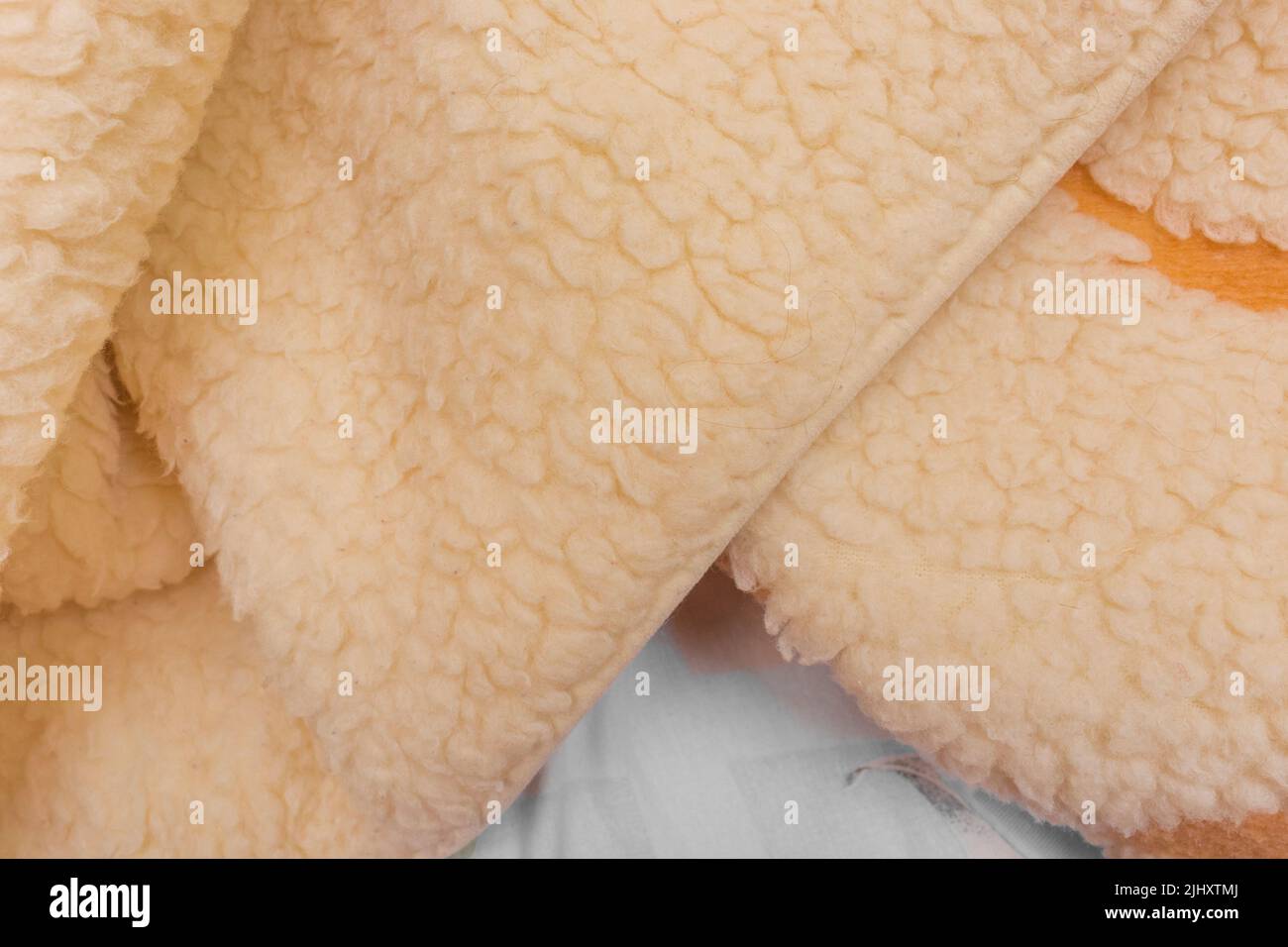 Yellow sheep material wool fur soft structure fleece fabric background ...