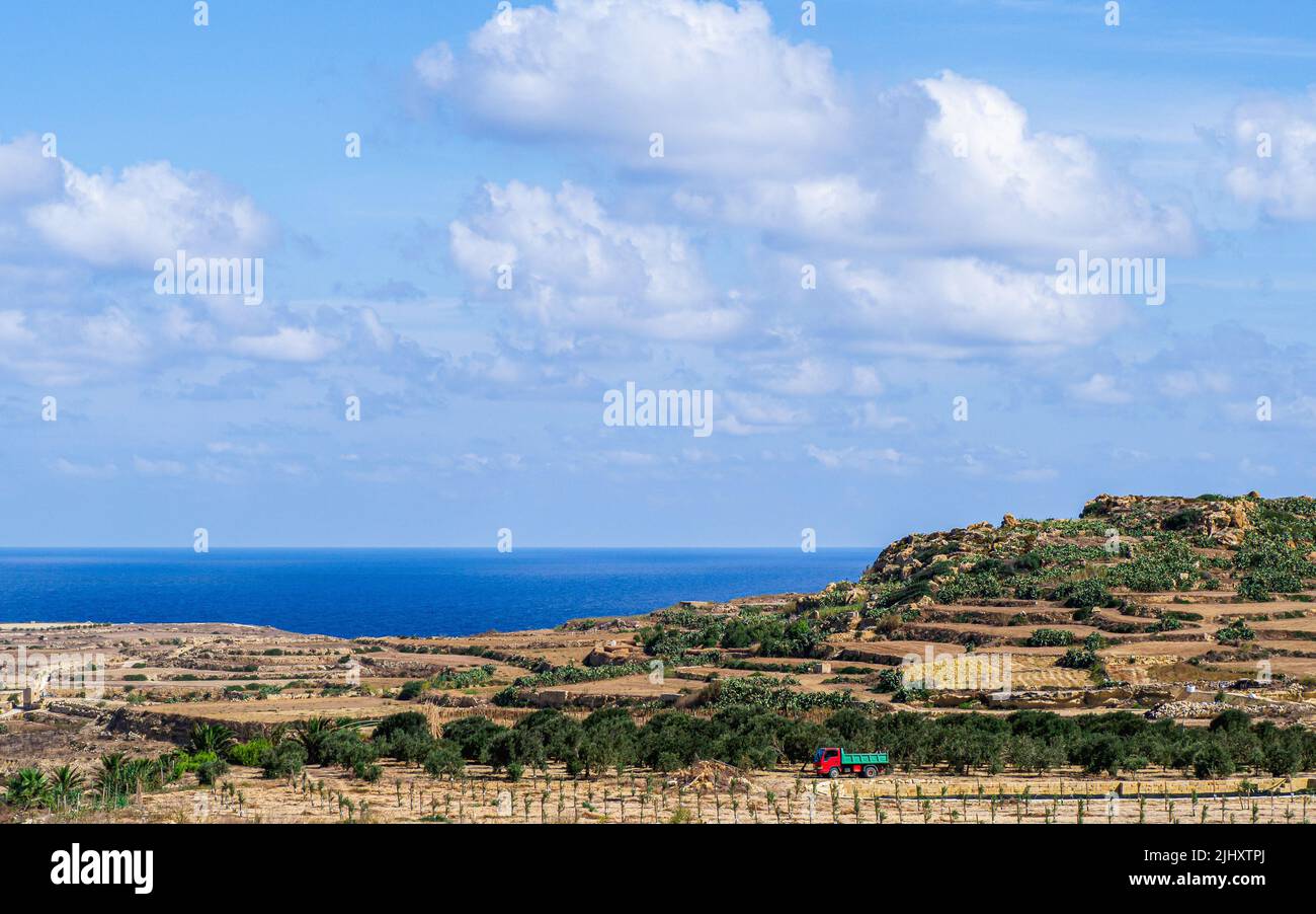 A waterside landscape with farm array layer on hill Stock Photo - Alamy