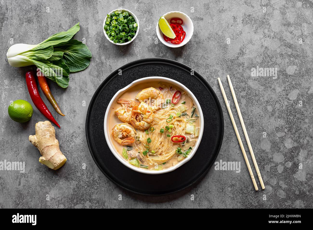A typical bowl of curry laksa, spicy glass noodle dish popular in ...