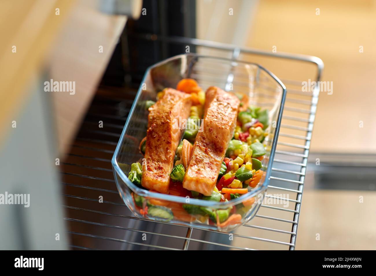food cooking in baking dish in oven at home Stock Photo - Alamy