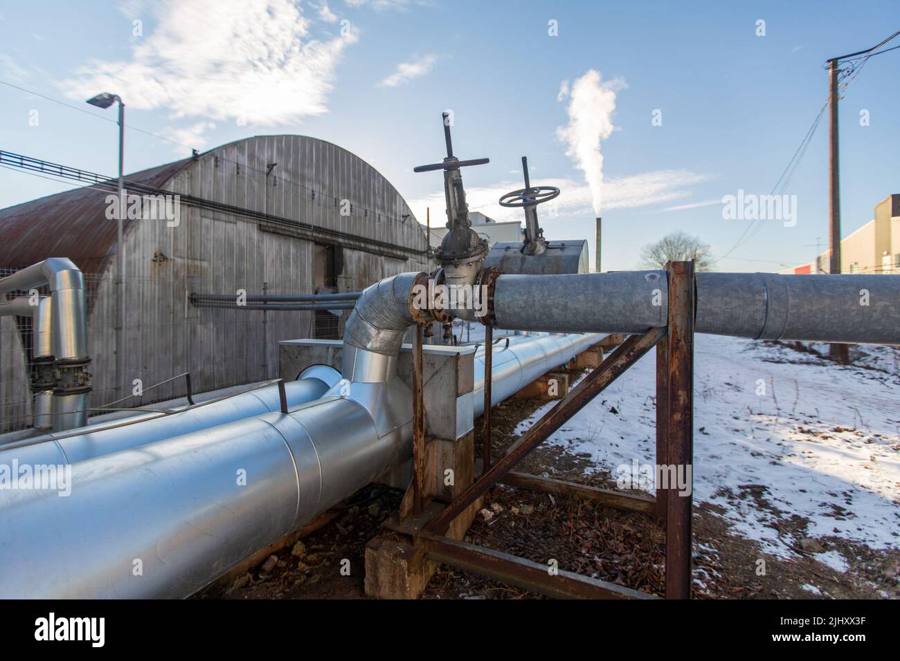 outdoor pipeline and old hangar in winter Stock Photo - Alamy