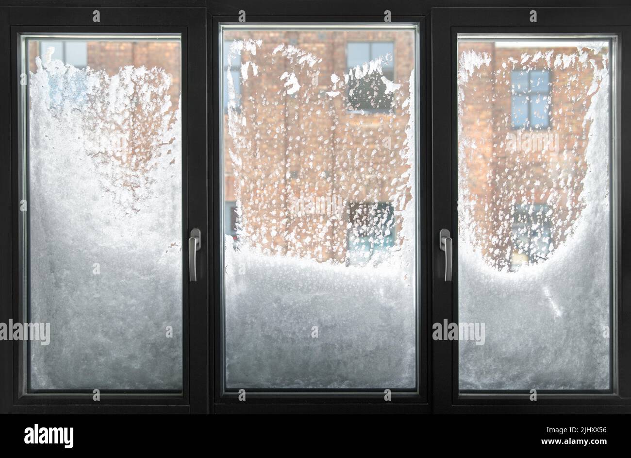 window glass covered with snow in winter Stock Photo - Alamy