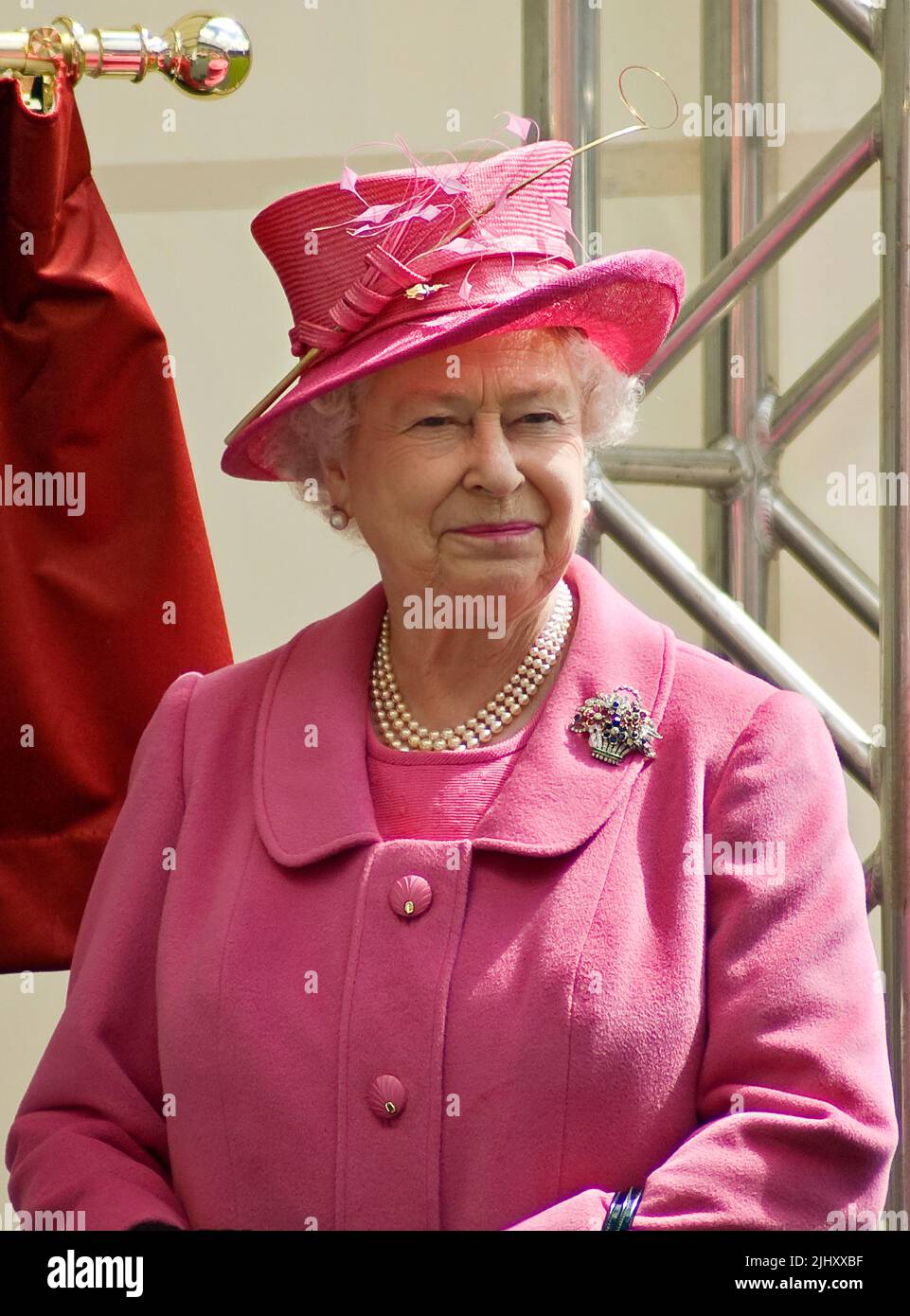 The beautiful Queen Elizabeth the second dressed fully in pink on a ...
