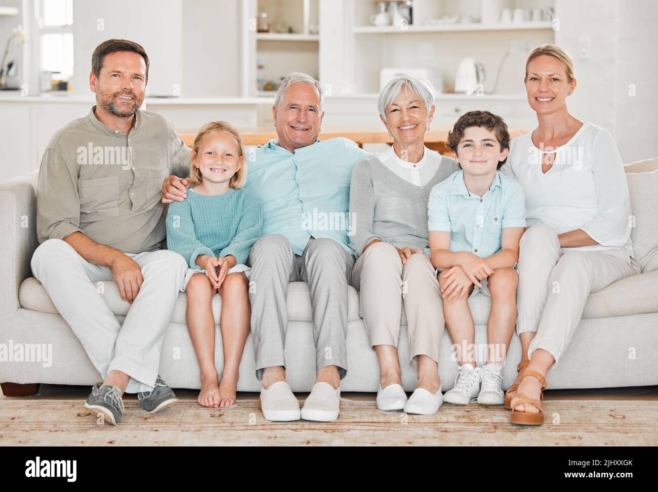 Family is everything to us. Full length portrait of two adorable little kids sitting on the sofa ...