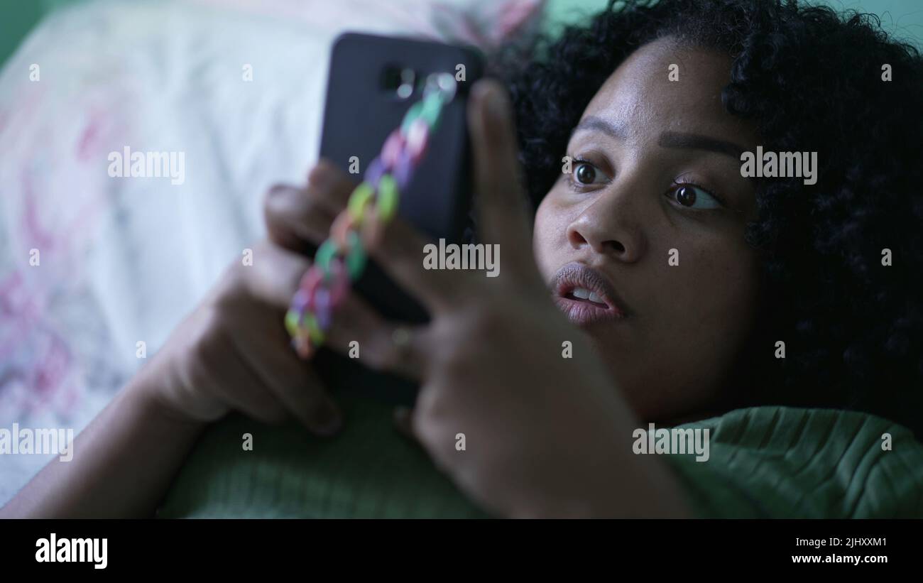 One black woman disbelief emotion reading content online shocking ...