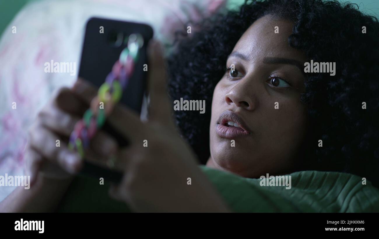 One black woman disbelief emotion reading content online shocking ...