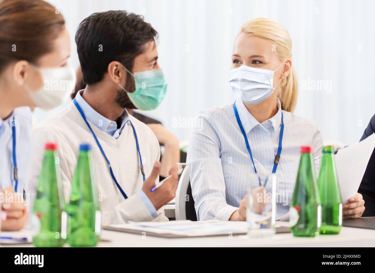 business people in masks at meeting or conference Stock Photo - Alamy