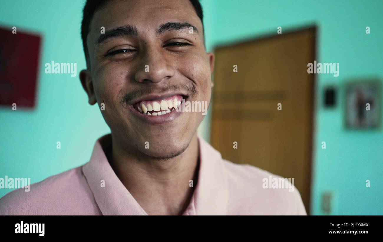 One happy hispanic man laughing and smiling at camera Stock Photo - Alamy