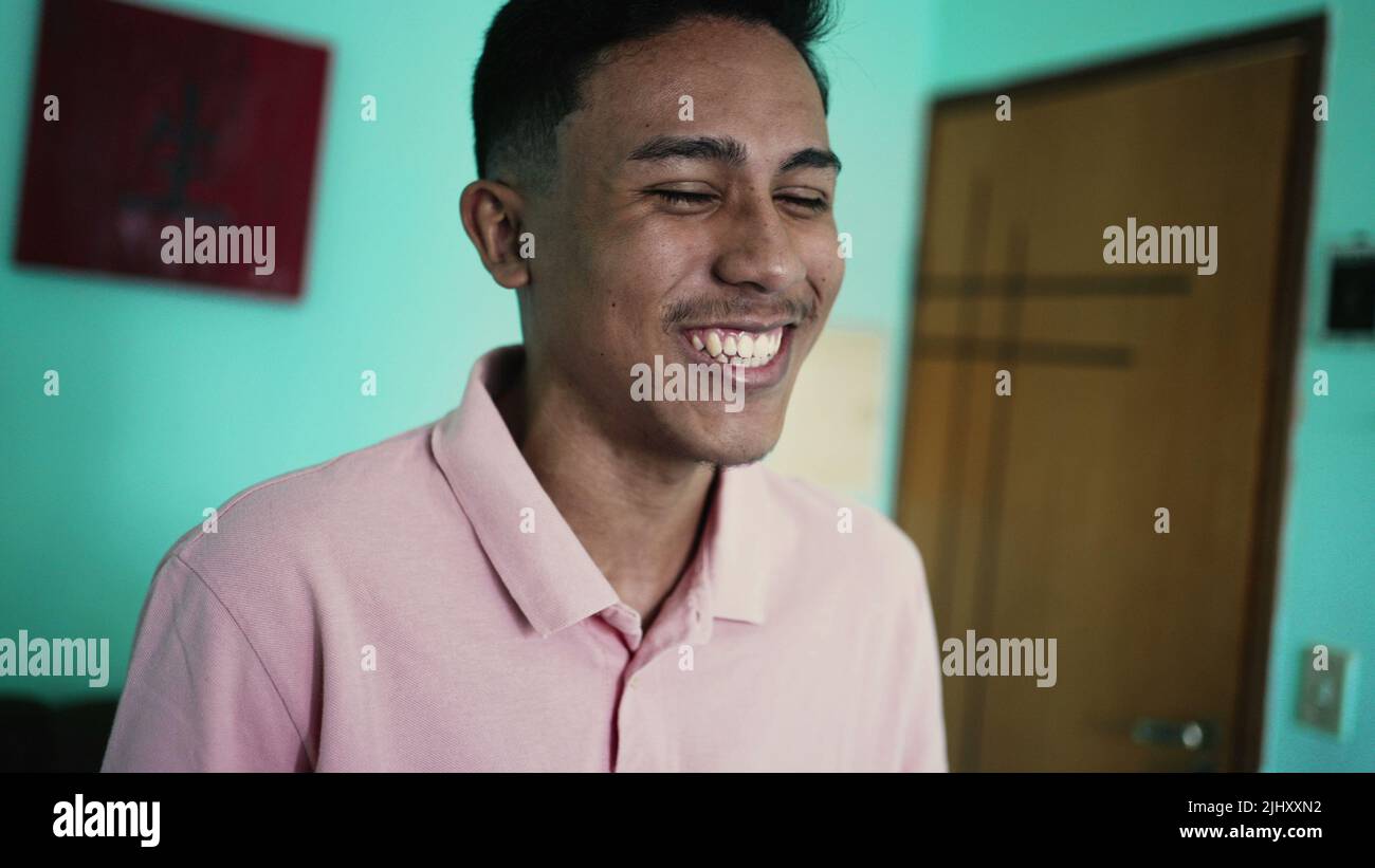 One happy hispanic man laughing and smiling at camera Stock Photo - Alamy
