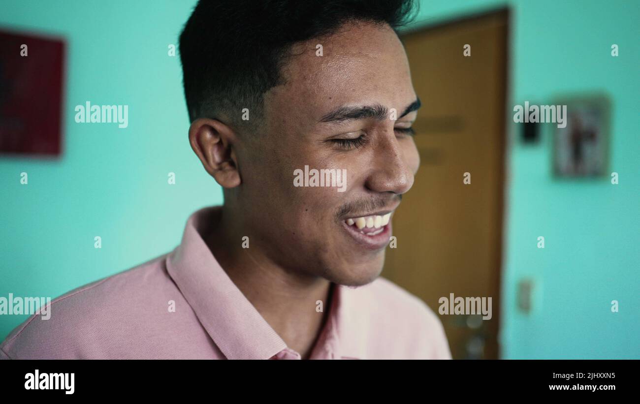 One happy hispanic man laughing and smiling at camera Stock Photo - Alamy