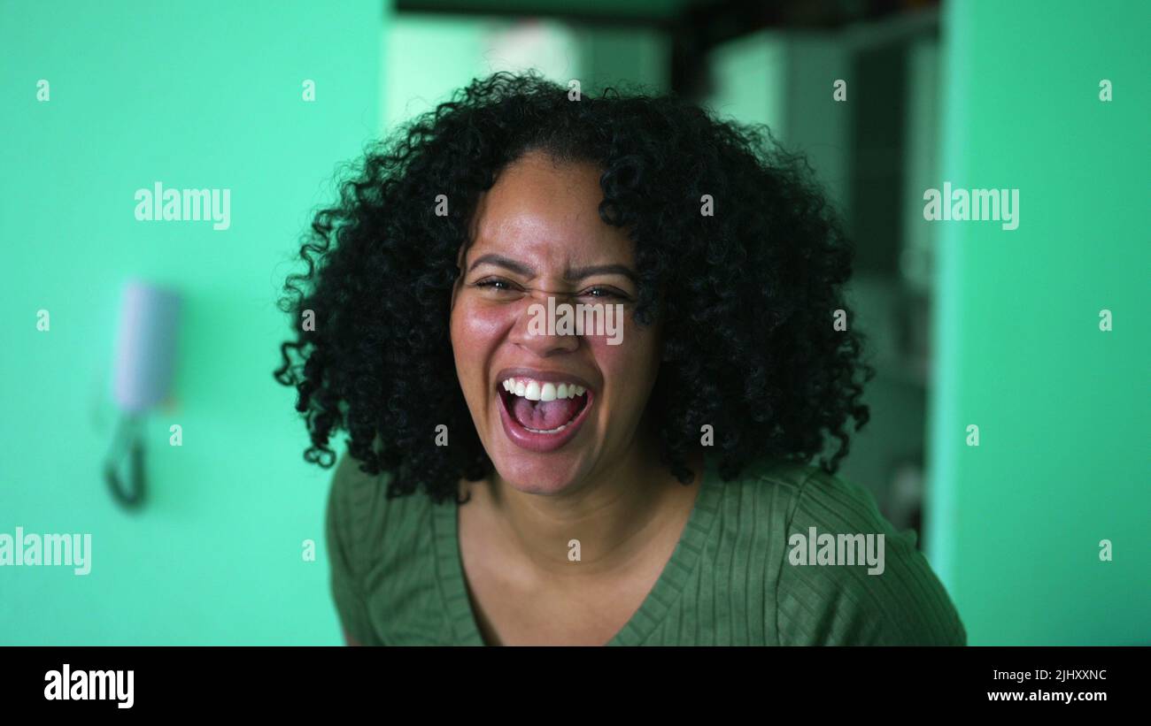 One happy black woman spontaneous laugh and smile Stock Photo - Alamy